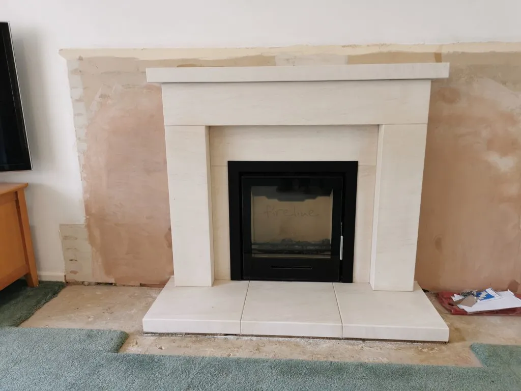 Stove Installation with Limestone Fireplace | Humphrey & Crockett